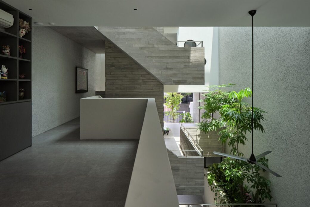 Terrace house with split-levels, skylights and indoor gardens ...